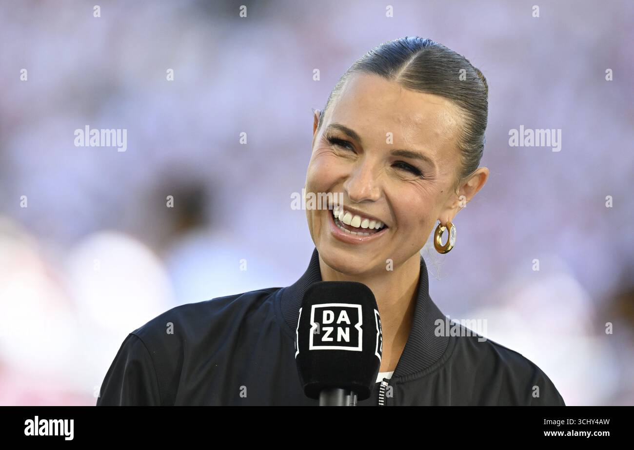 DAZN presenter Laura Wontorra, smiling in interview microphone ...