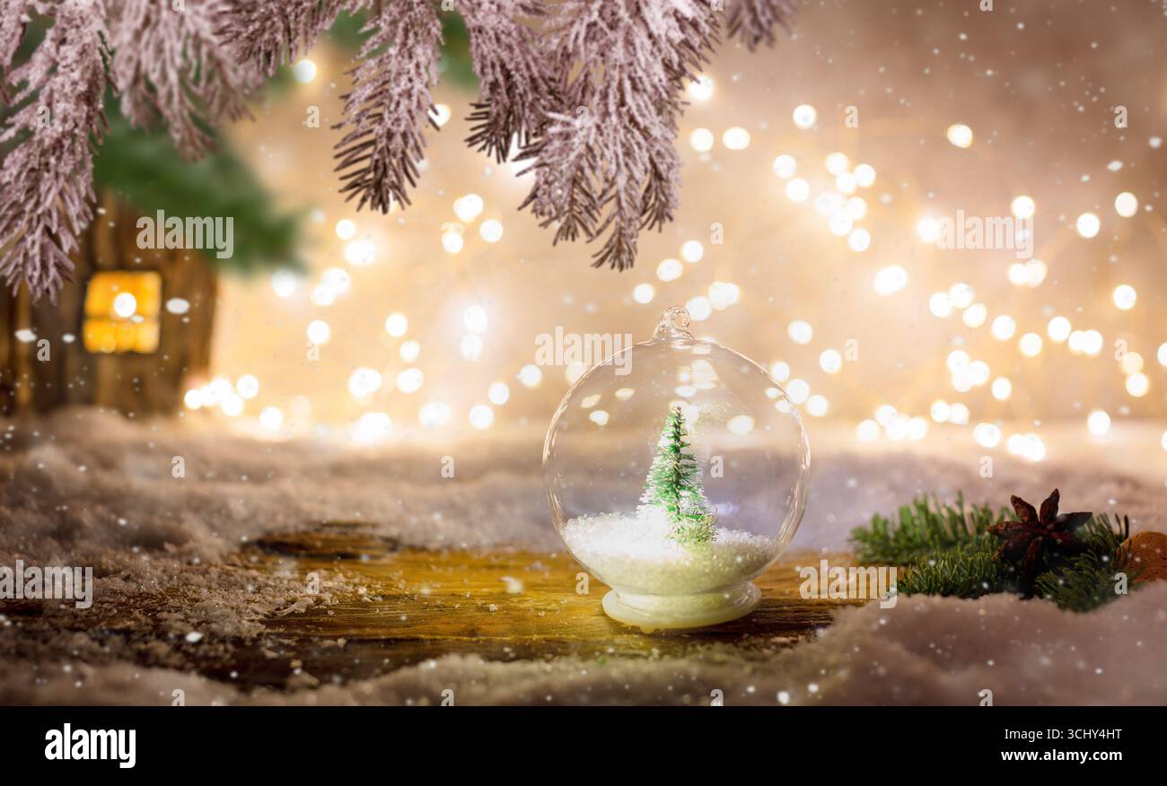 decorative fir tree with artificial snow in a glass Christmas tree ball ...