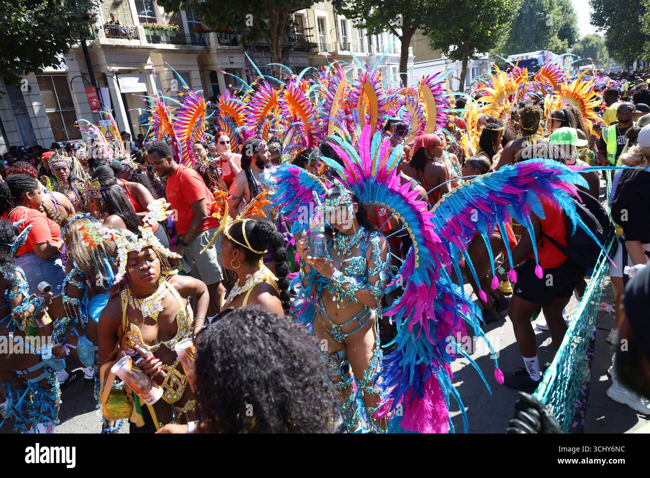 Dancers in feathered costumes at the Notting Hill Carnival in London ...
