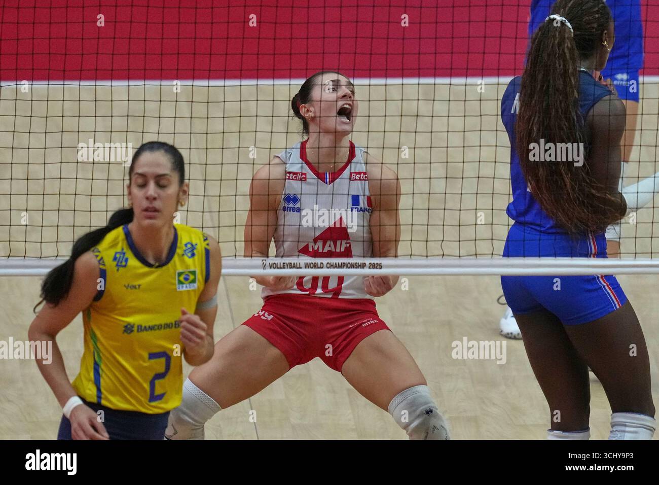 France's Gelin, center, reacts after scoring a point during the FIVB ...