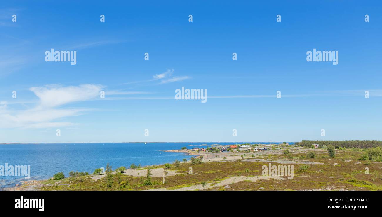 Scenic view of a Finnish fishing village by the sea. Traditional wooden ...