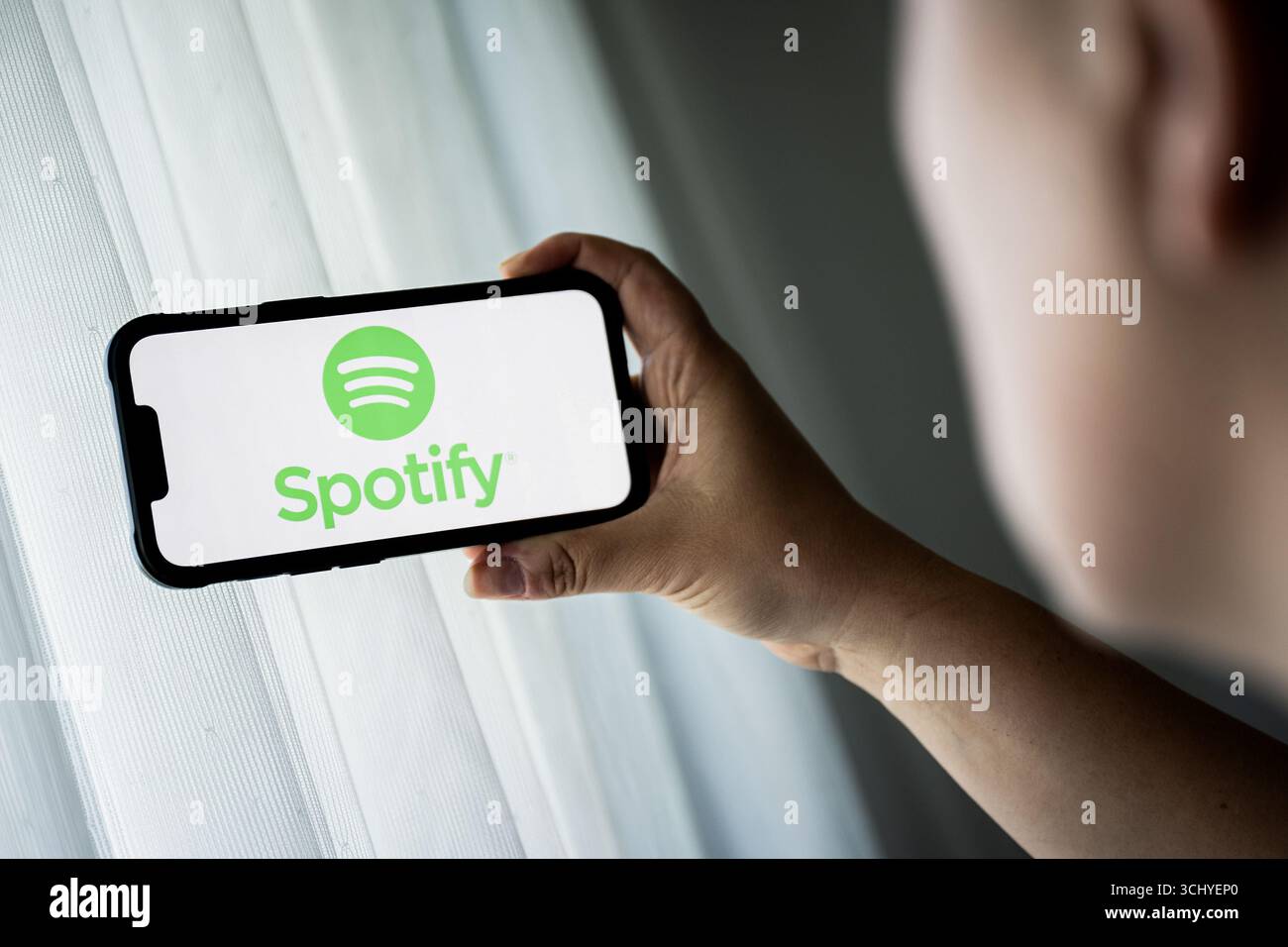 In this photo illustration, a Spotify logo is seen displayed on a smartphone. (Photo by Mateusz ...