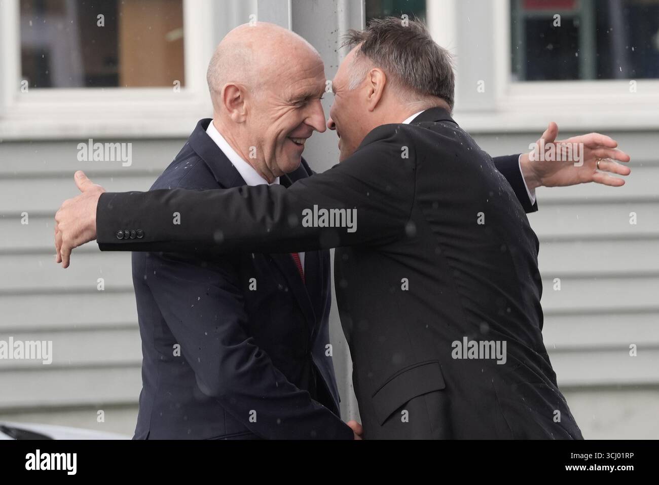 Defence Secretary John Healey (left) is greeted by Defence Minister ...