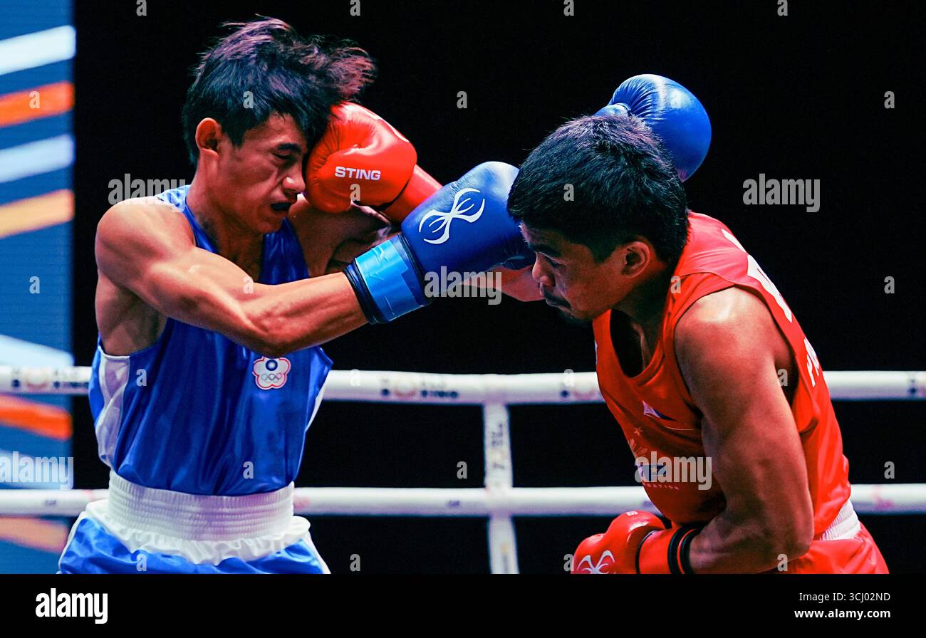 Chiao-Chun of Chinese Taipei (left) in action against Carlo Paalam of ...