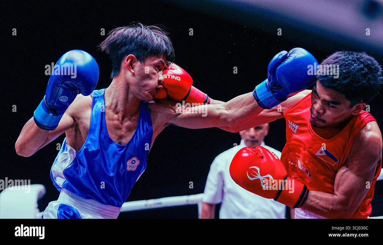 Chiao-Chun of Chinese Taipei (left) in action against Carlo Paalam of ...