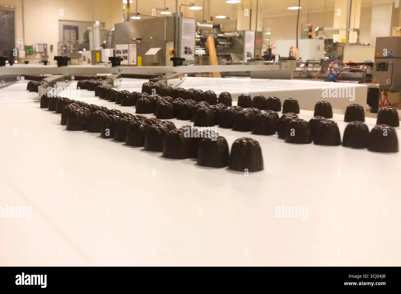 Box candies on conveyor candy hi-res stock photography and images - Alamy