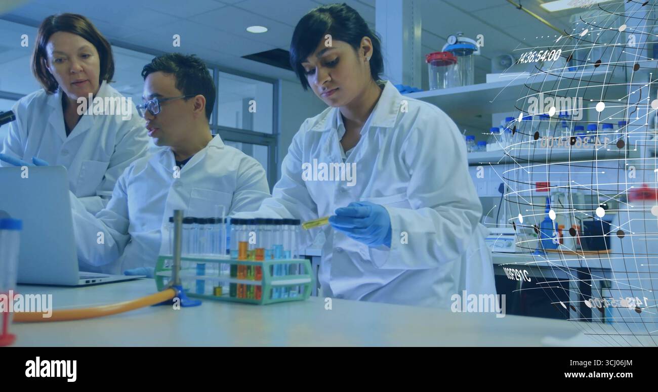 Pipetting scientist transferring yellow solution into test tubes at lab ...