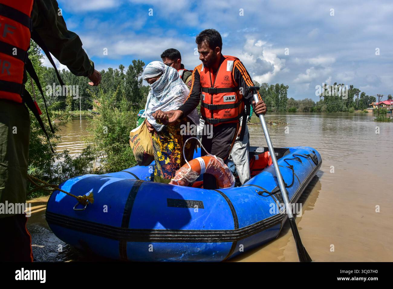 Members of the State Disaster Response Force (SDRF) rescues a flood ...