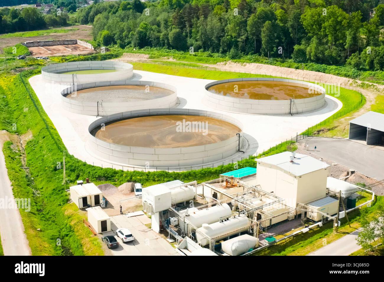 Manure treatment tanks at biogas production factory Stock Photo - Alamy