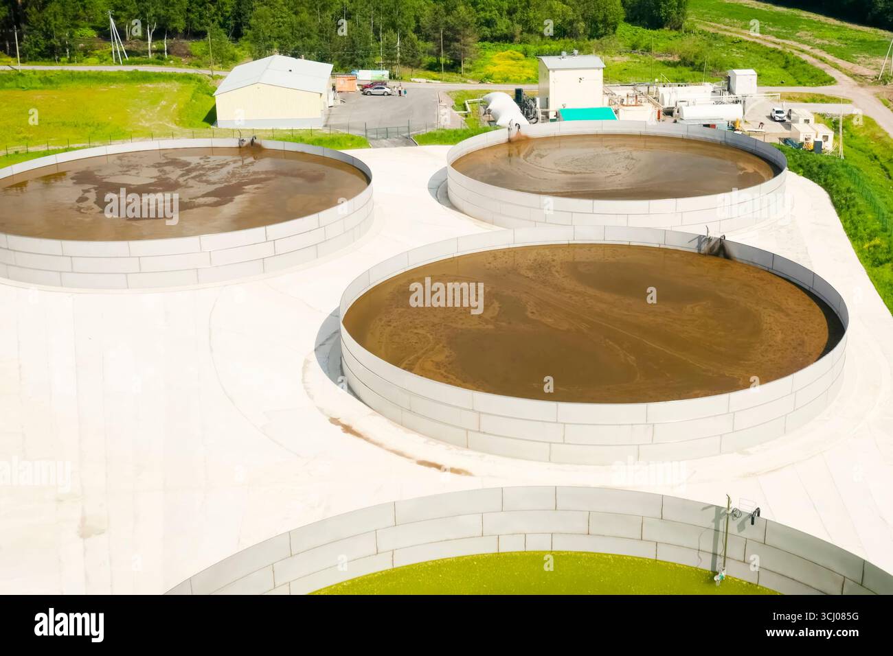 Manure treatment tanks at biogas production factory Stock Photo - Alamy