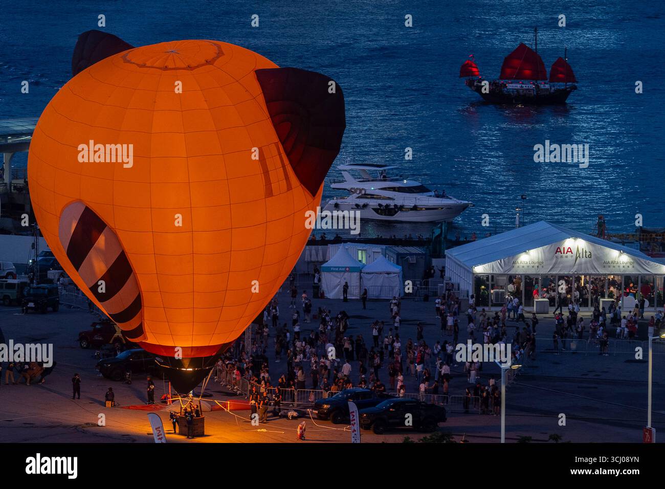 A hot air balloon is tethered to the ground during the International ...