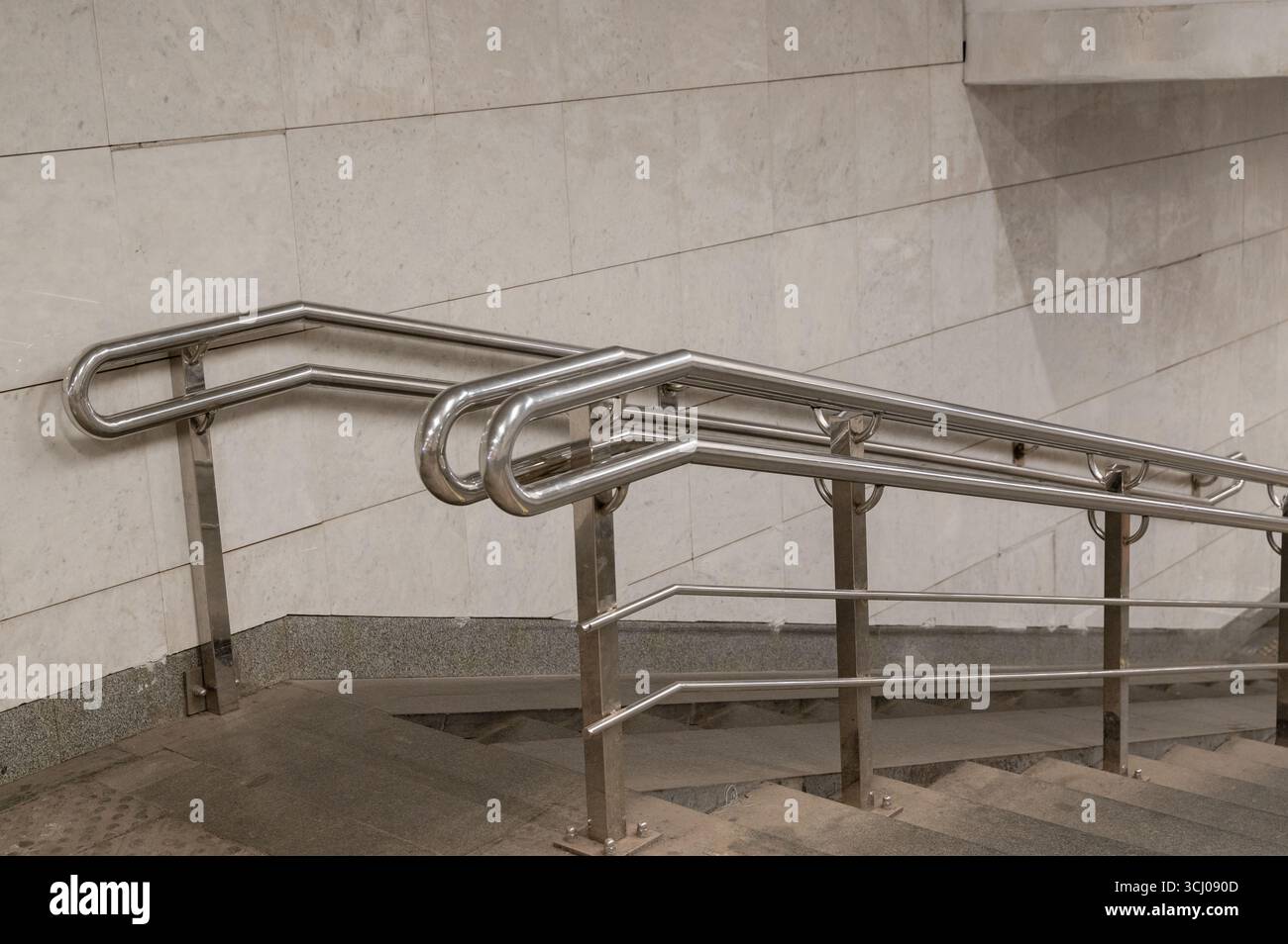 Stylish stainless steel handrail design along indoor stairs, ensuring ...