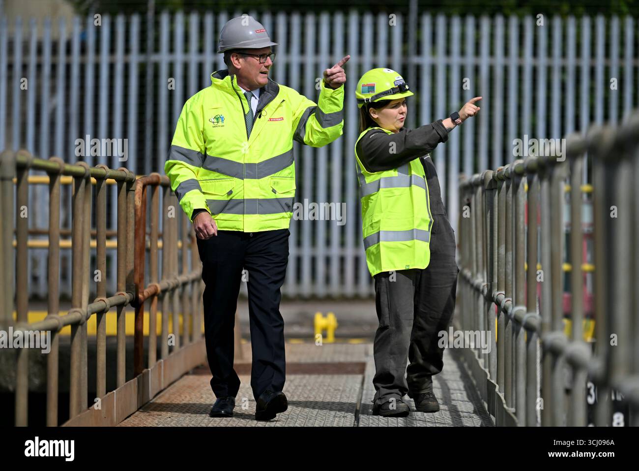 Britain's Prime Minister Keir Starmer, left, walks with electral ...