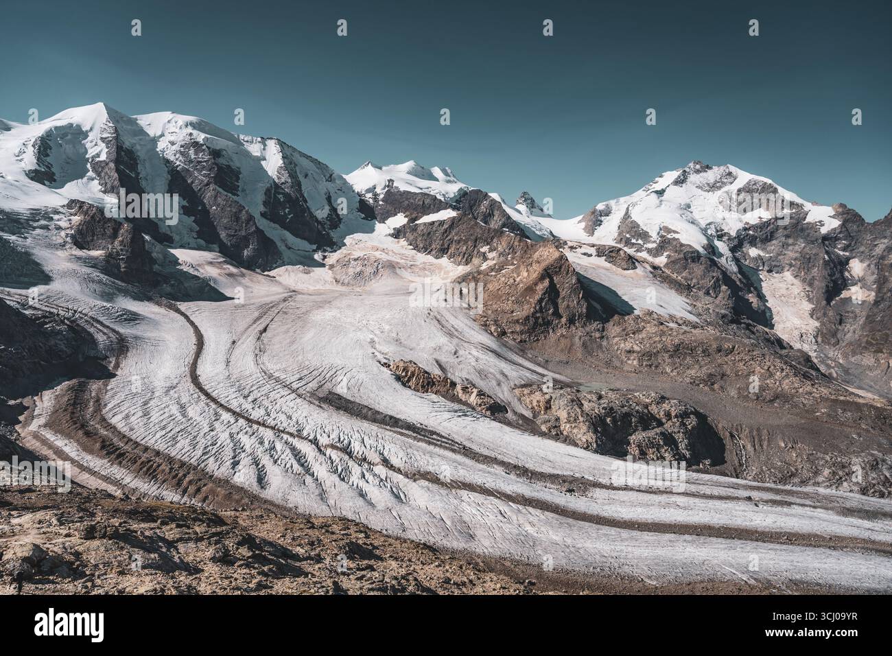 High peaks of Piz Bernina and Piz Palu rise dramatically above the Pers ...