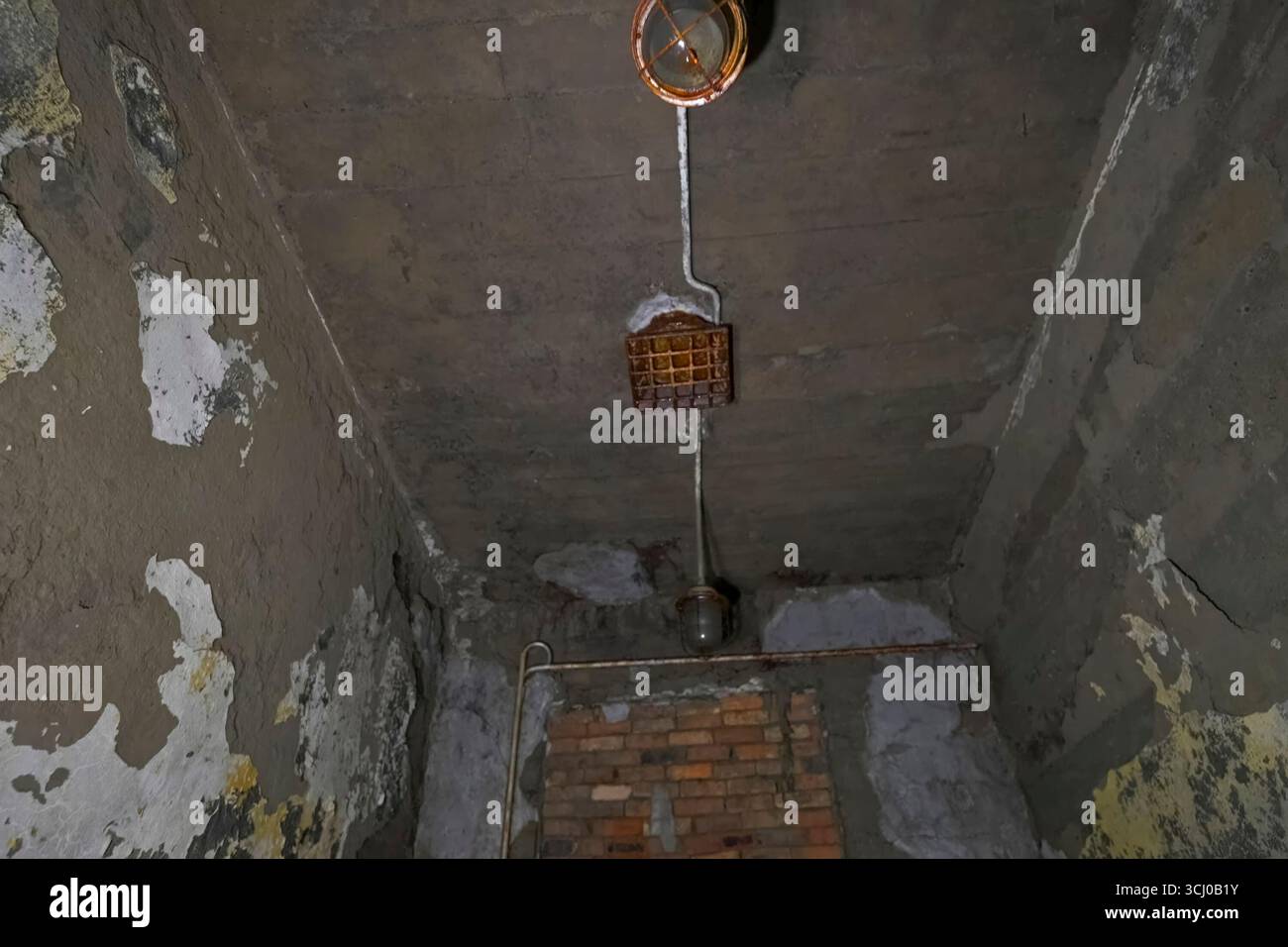 equipment, wiring and pipes in an abandoned underground bunker, shabby ...