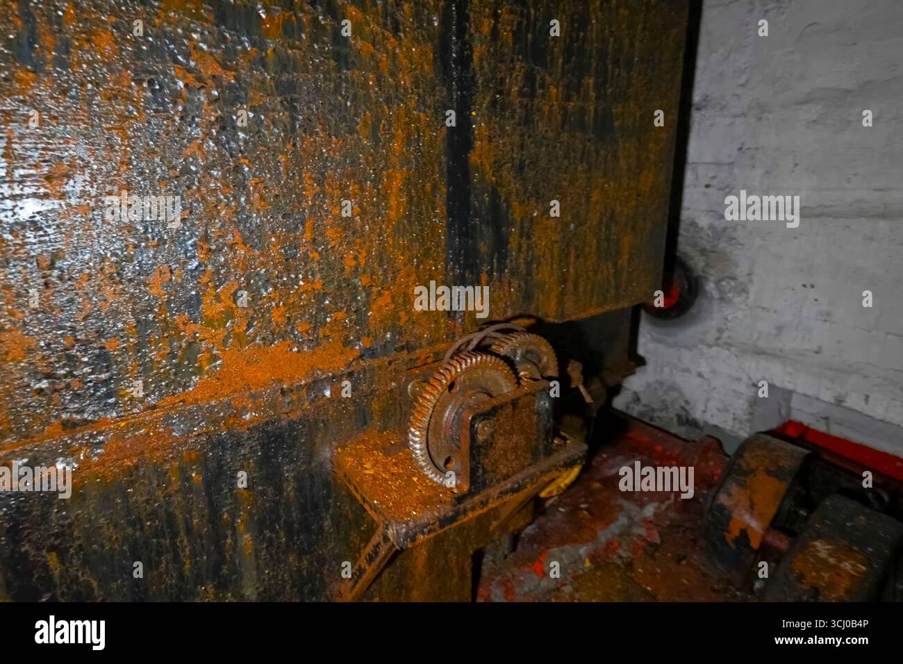 equipment, wiring and pipes in an abandoned underground bunker, shabby ...