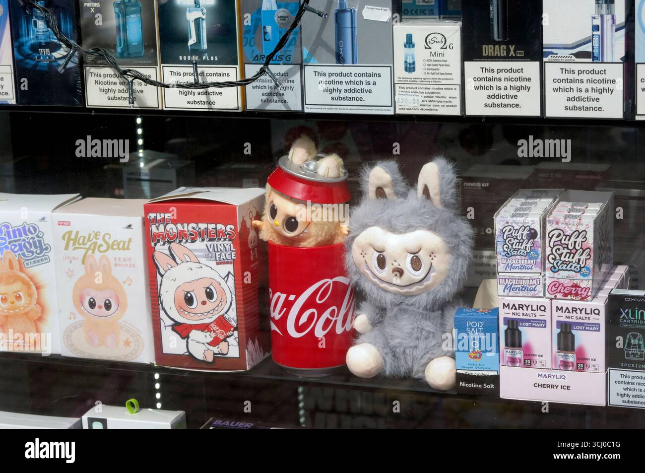 Labubu Toys in Vape and Mobile Phone Shop Window Stock Photo - Alamy