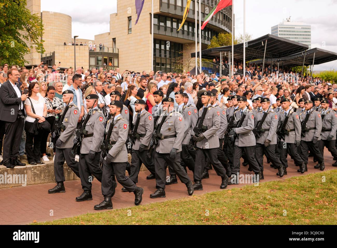 Soldiers march with guns at an oath ceremony for new recruits of the ...