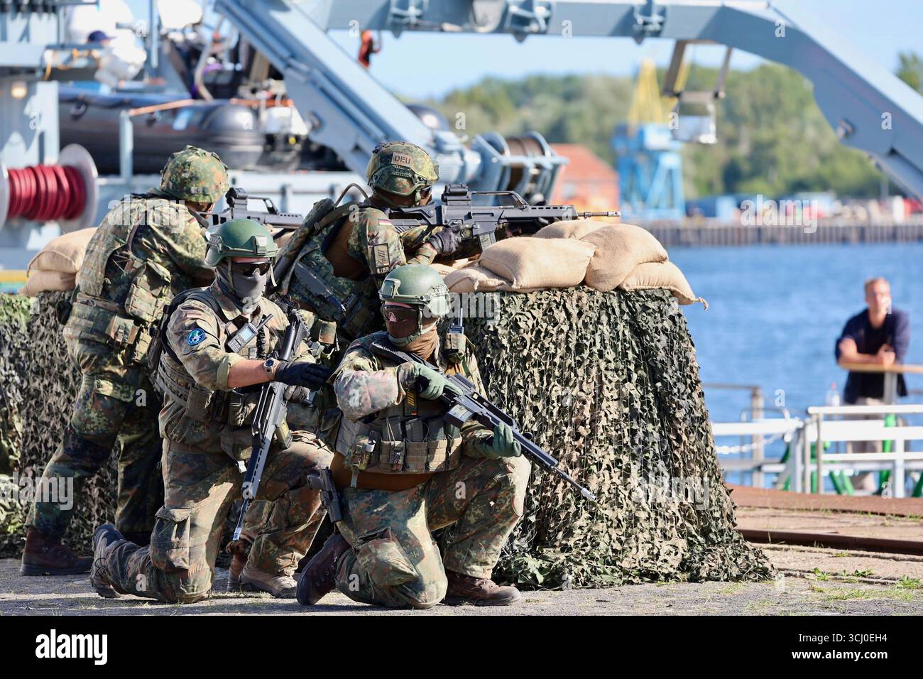Soldiers of the German forces, Bundeswehr, secure the port at the start ...