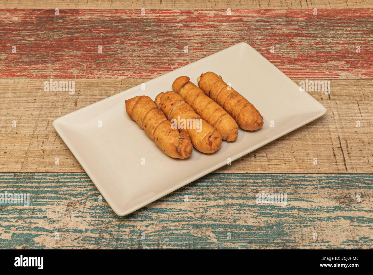 Crispy fried tequeños with small blisters on the surface of the dough ...