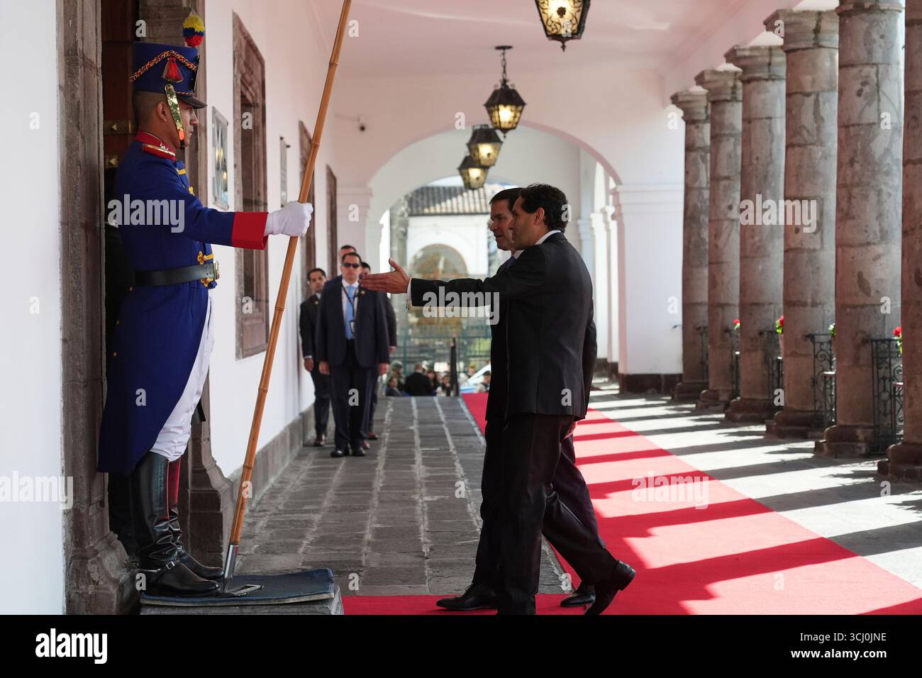 A protocol officer shows the way to U.S. Secretary of State Marco Rubio ...