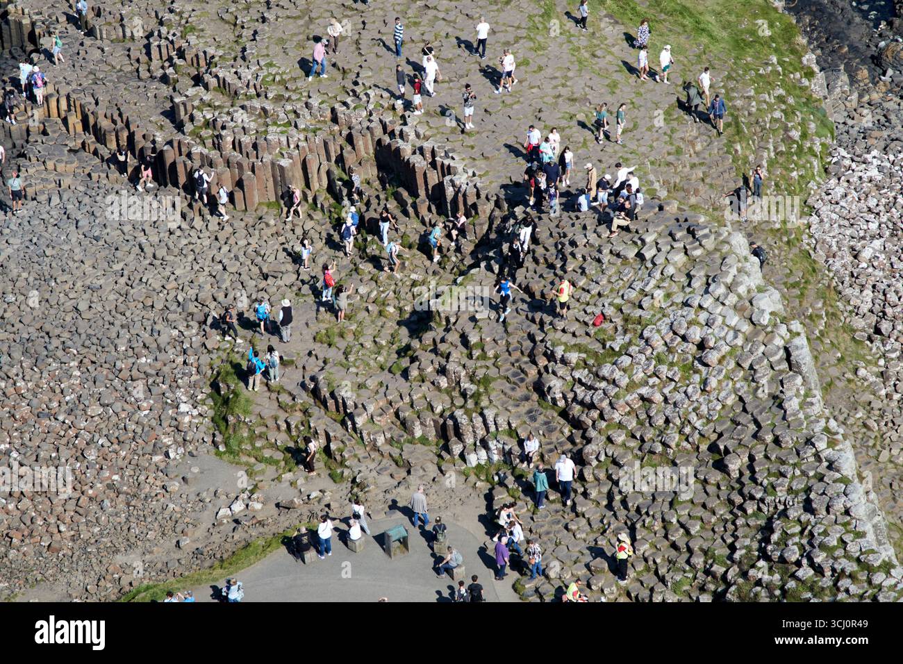 looking down from viewpoint on the upper cliff path at tourists on the ...