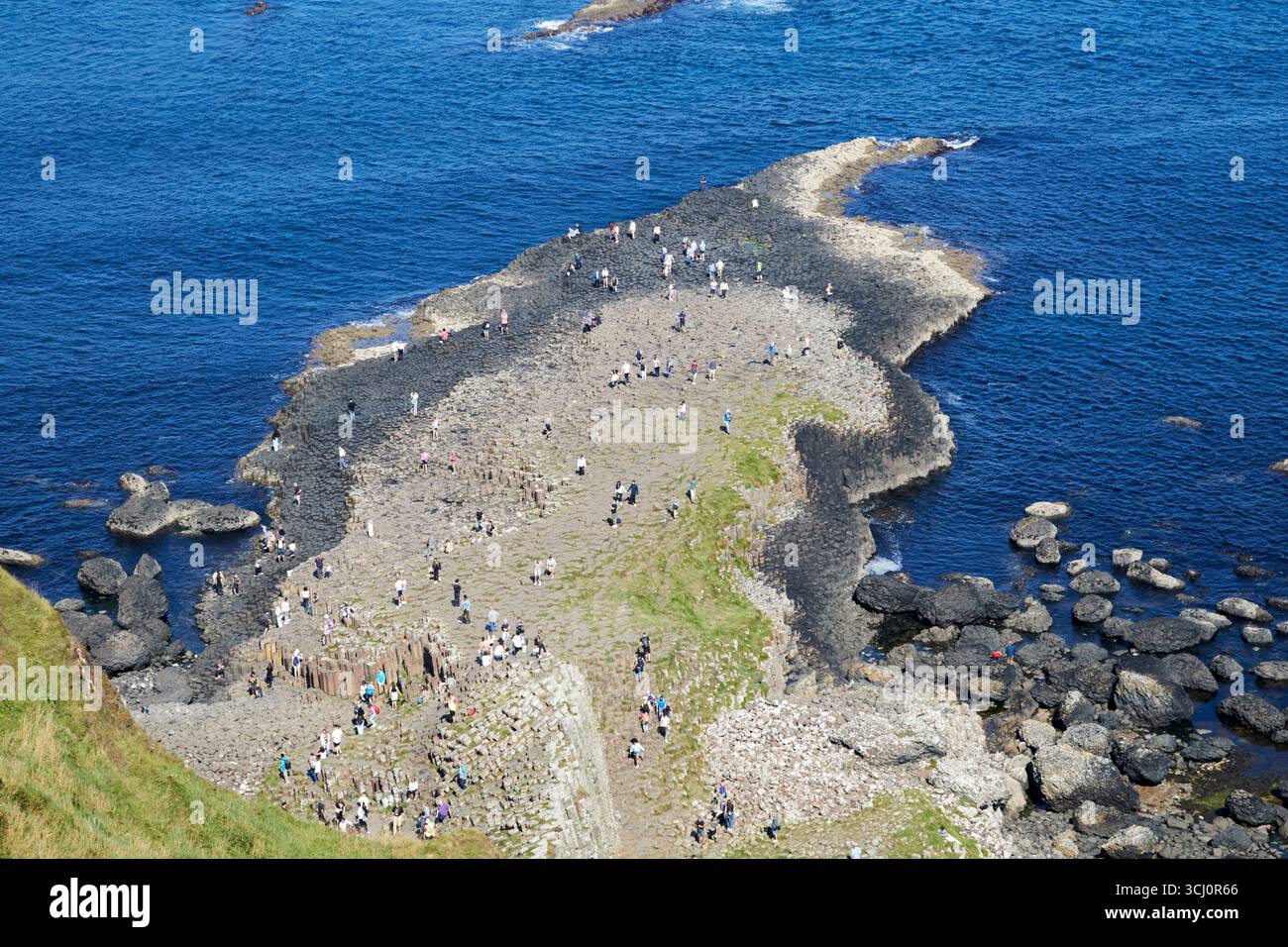 looking down from viewpoint on the upper cliff path at tourists on the ...