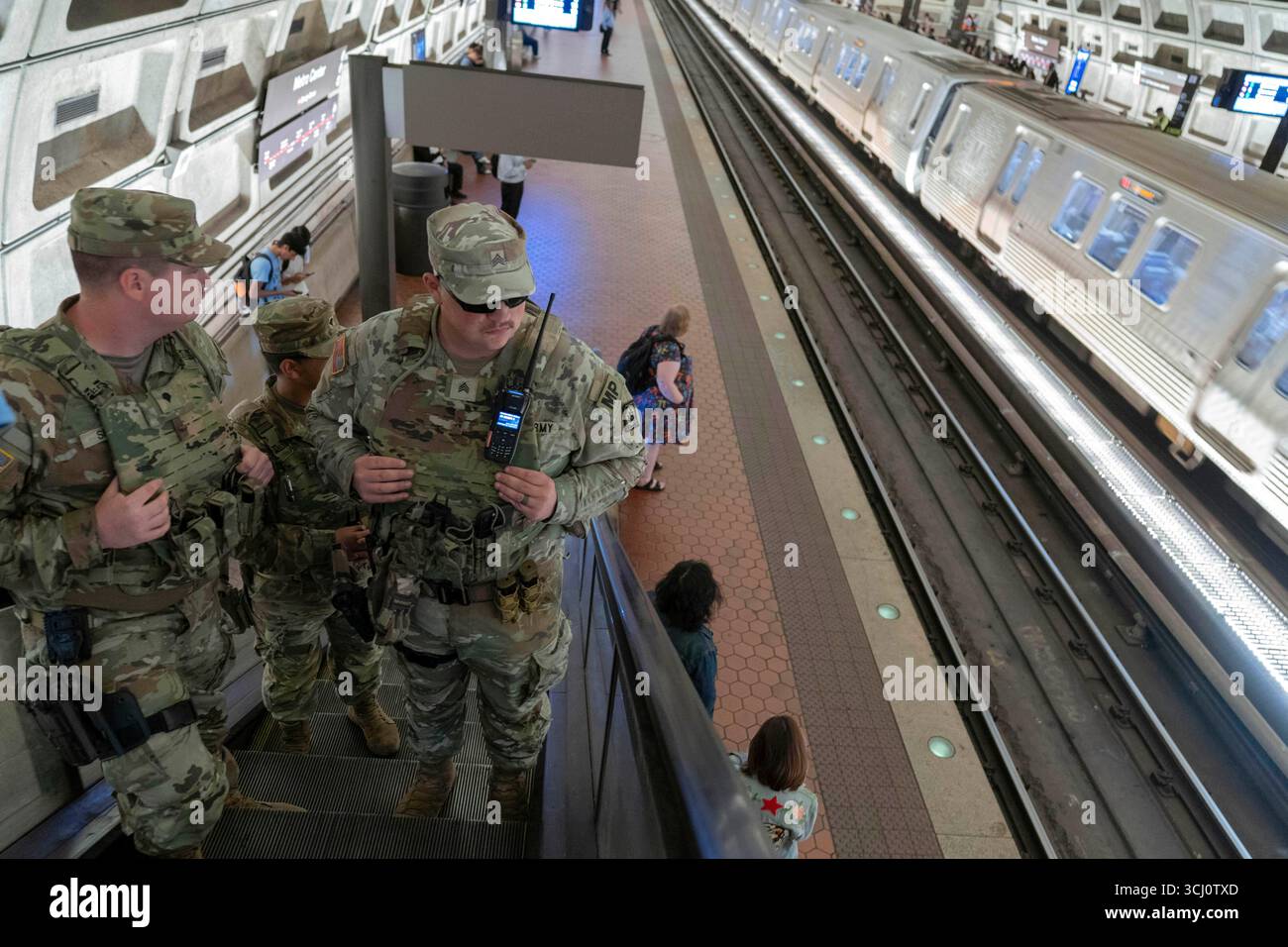 Members of the National Guard patrol Metro Center metro station Tuesday ...