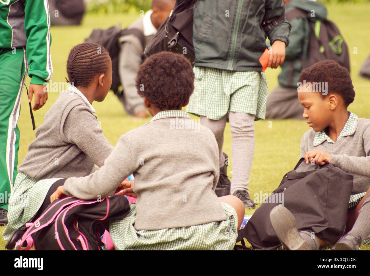 African schoolgirls in uniforms gathering together at lunch time Stock ...