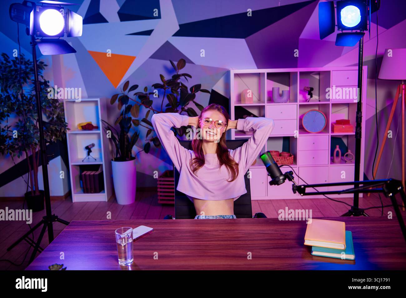 Popular female podcaster with neon lighting creates engaging content in ...