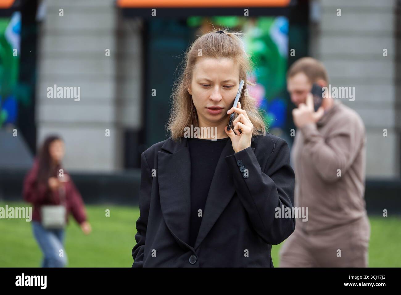 Girl jacket talk man hi-res stock photography and images - Alamy