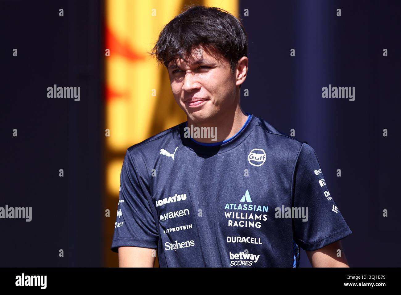 Alexander Albon of Williams Racing looks on in the Paddock during ...