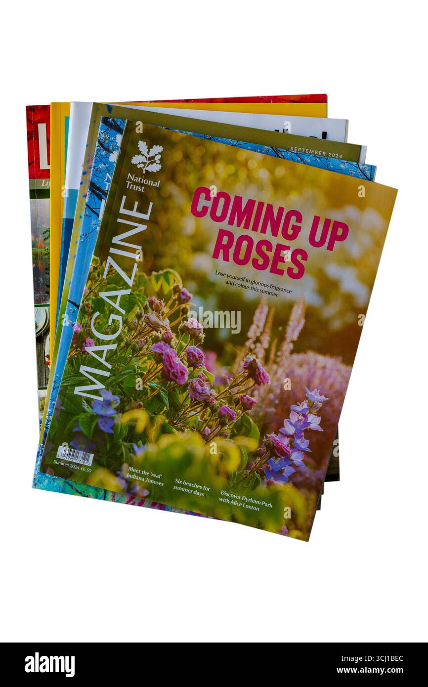 Pile of magazines with National Trust magazine on top isolated on white ...
