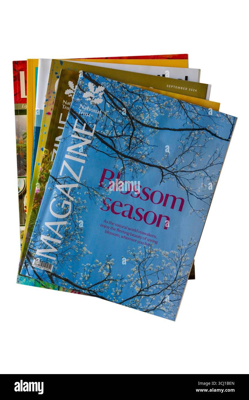 Pile of magazine with National Trust magazine on top isolated on white ...