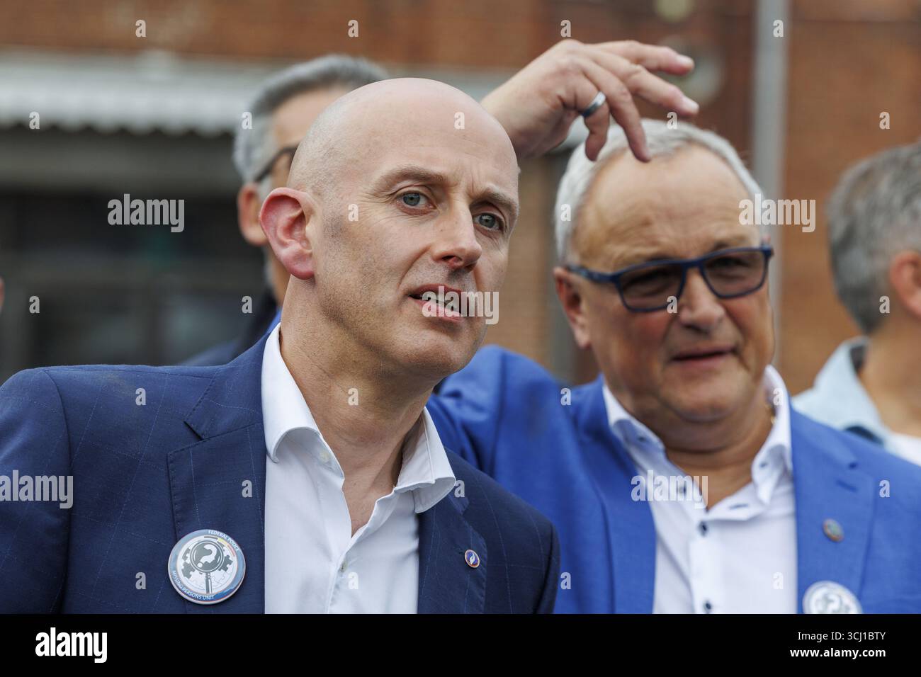 Gerry Van Loock and policeman Alain Remue pictured during the ...