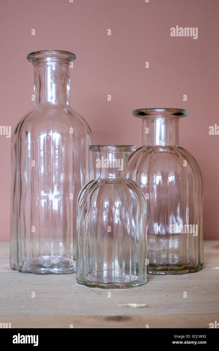Three elegant glass vases of different heights and shapes, featuring ...