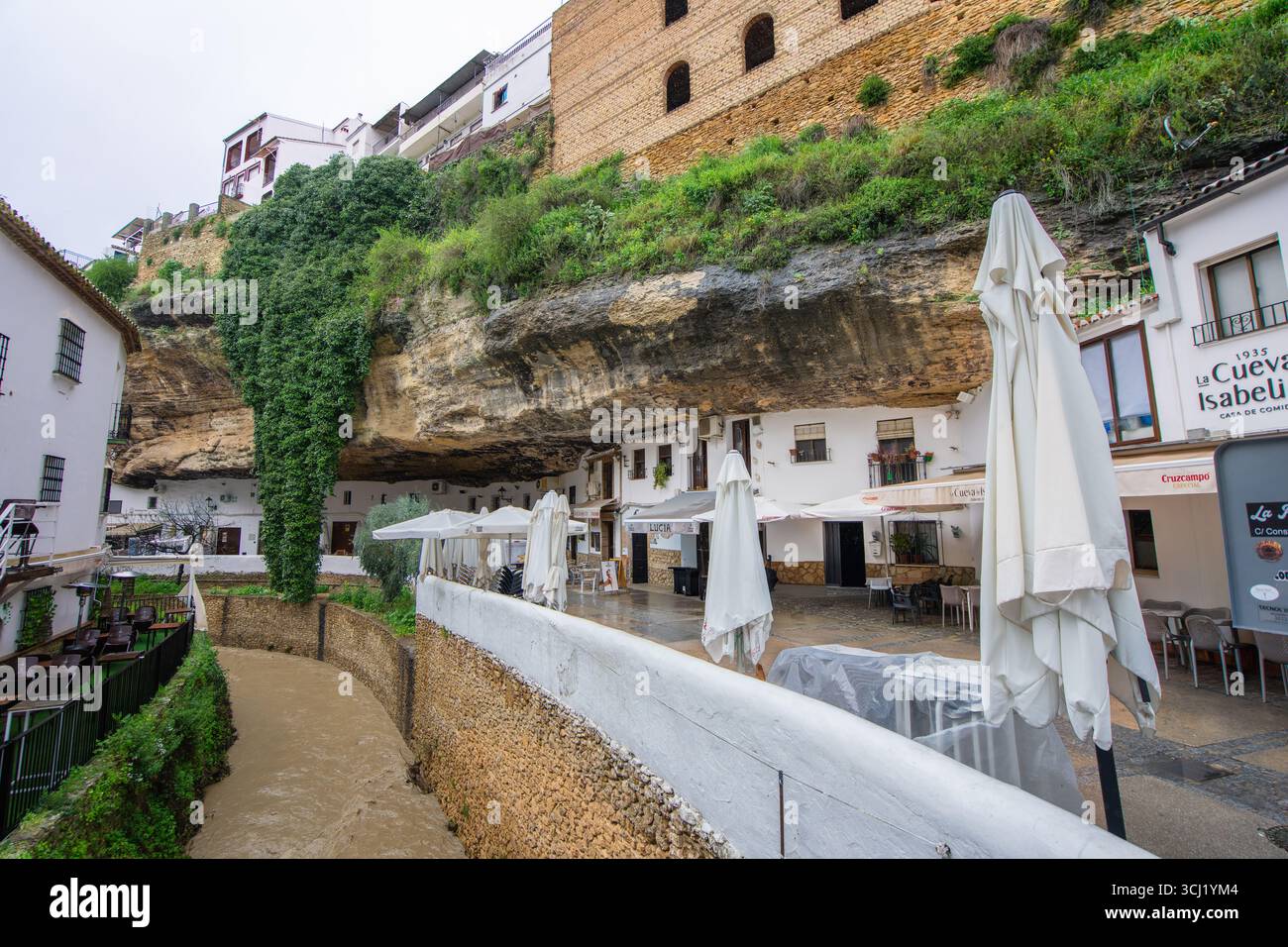 Setenil de las Bodegas, Spain - March 11, 2025: White buildings built ...