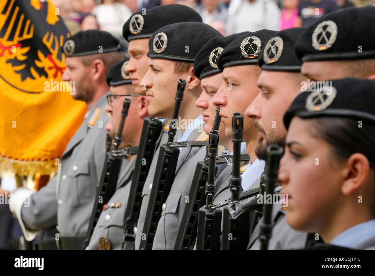 Soldiers watching new recruits of the German Army Bundeswehr attending ...
