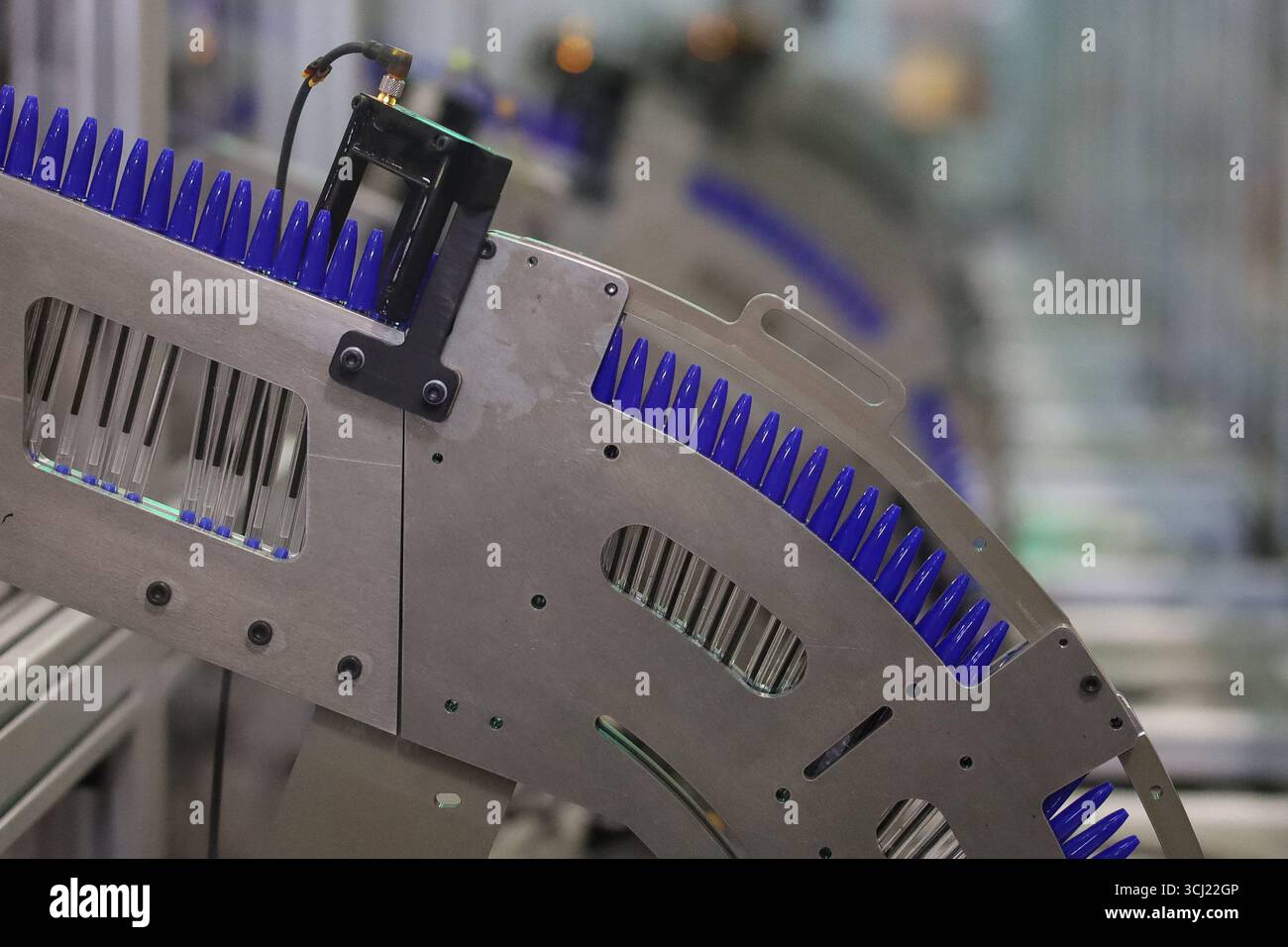 A close-up view of BIC pens on the production line at BIC Factory in ...