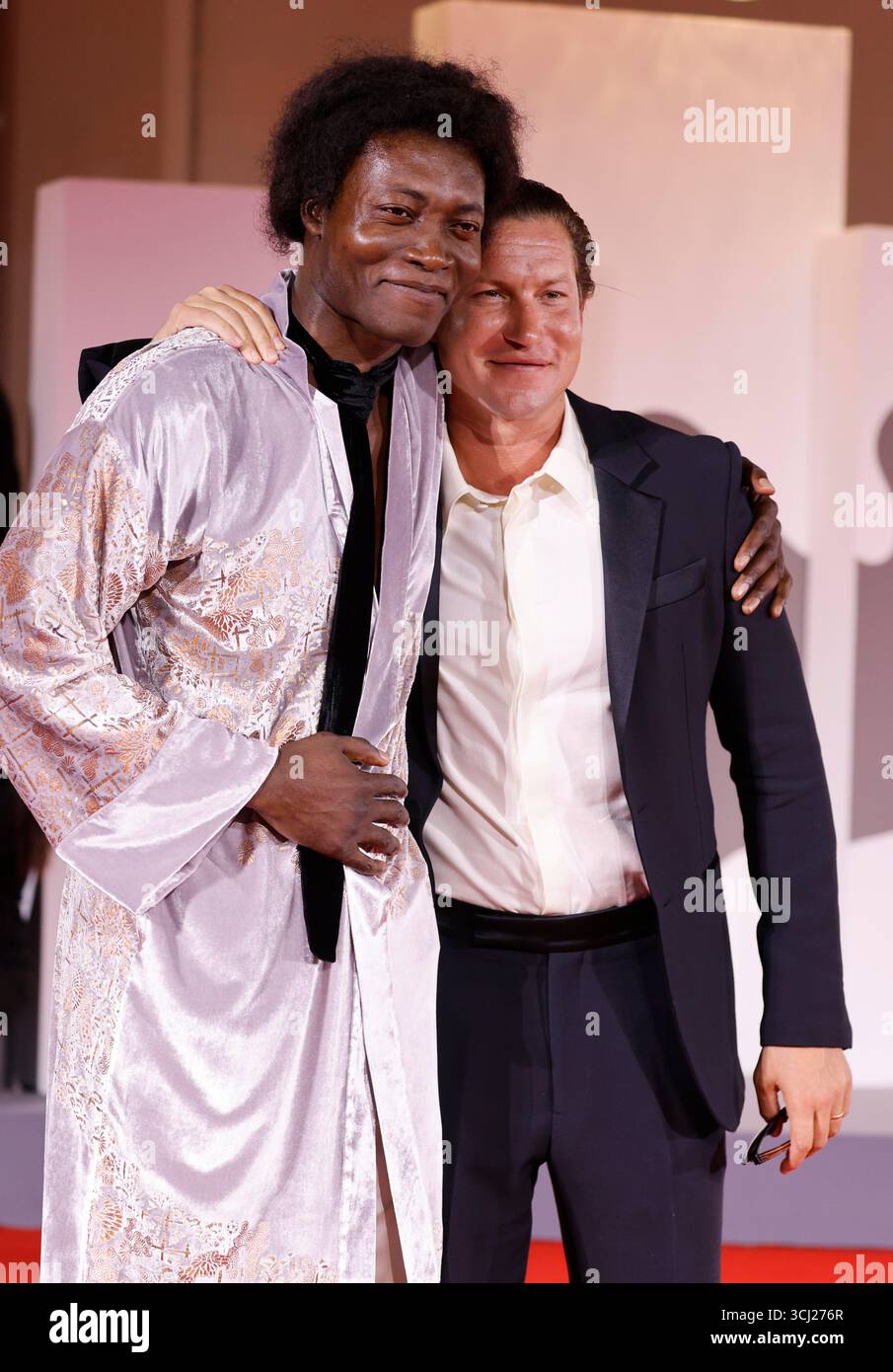 Benjamin Clementine and Vito Schnabel attend the premiere of 'Duse' during the 82nd Venice ...
