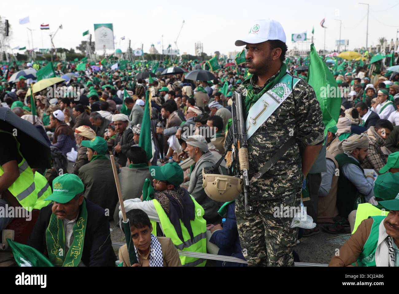 People wave Islamic flags during the Mawlid celebration marking the ...