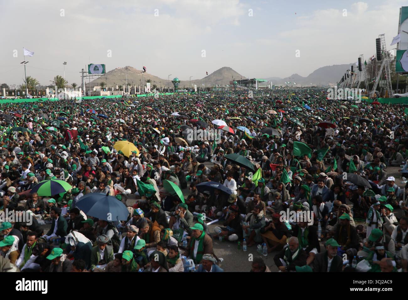 People wave Islamic flags during the Mawlid celebration marking the ...