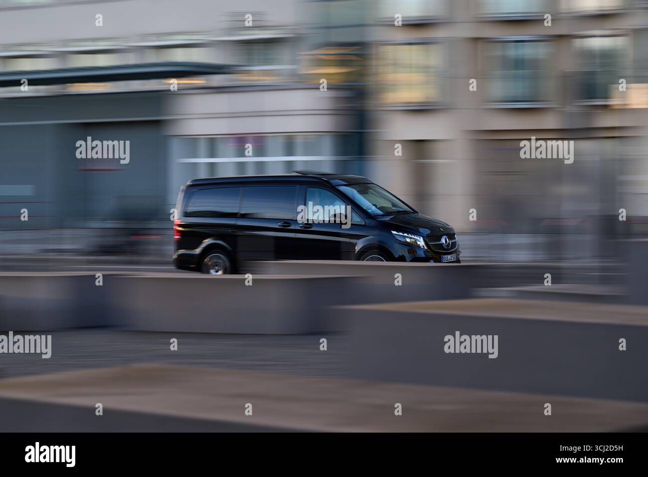Black van driving past Holocaust Memorial in Berlin, daytime, urban ...
