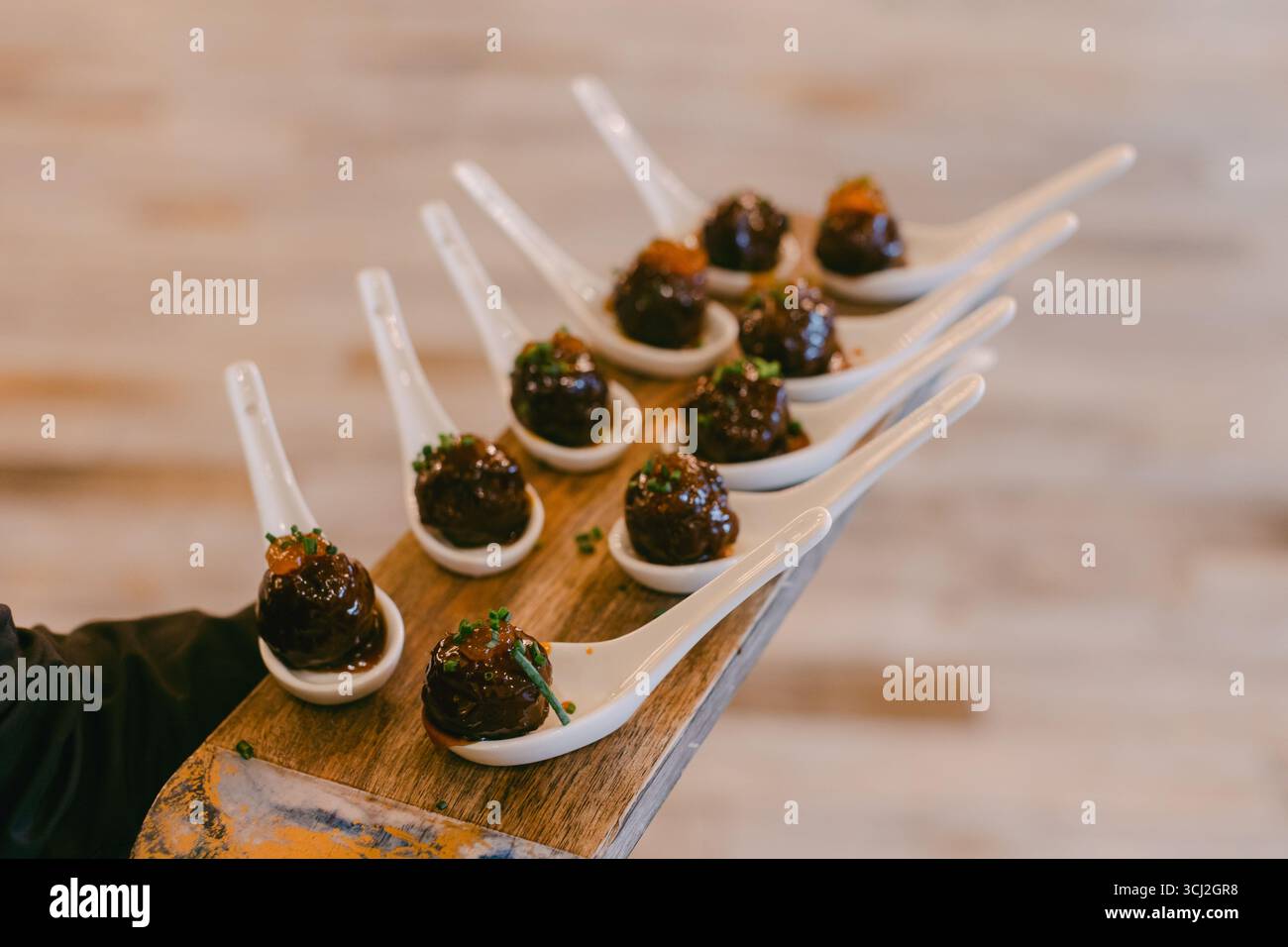 Gourmet appetizers presented on elegant spoons showcase creativity and ...