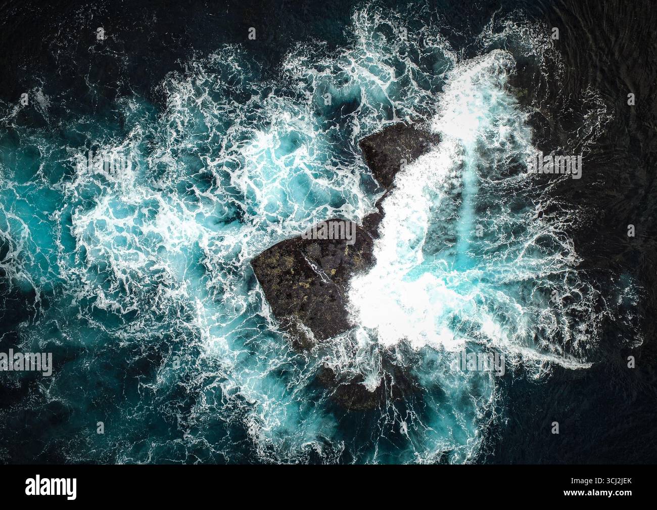 Ocean waves swirl crash around hi-res stock photography and images - Alamy