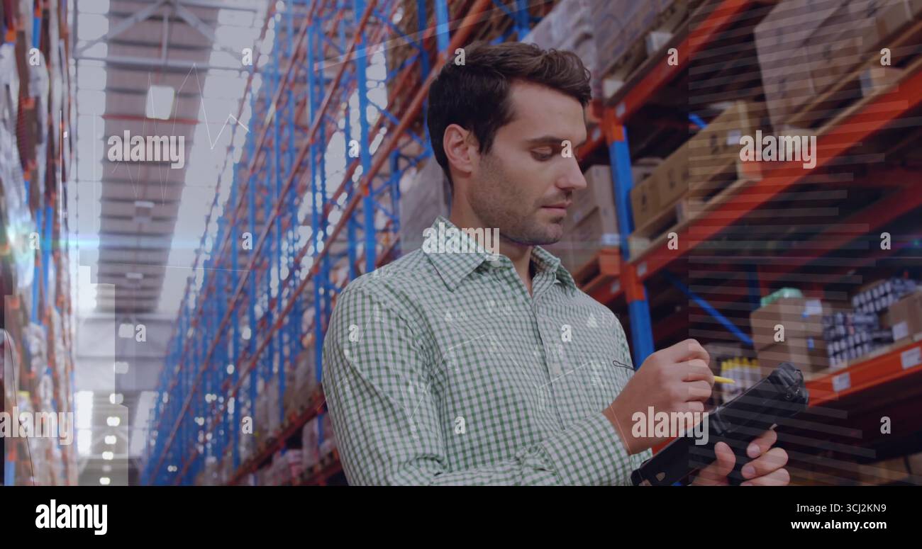 Warehouse worker wearing checkered shirt scanning boxes in aisle, with ...