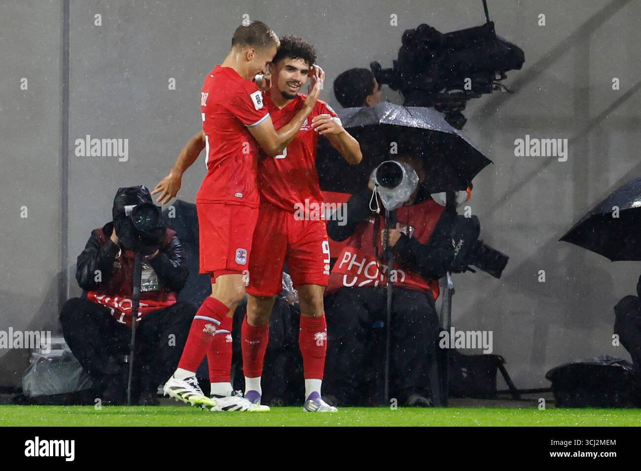Luxembourg's Aiman Dardari, right, celebrates with a teammate after ...