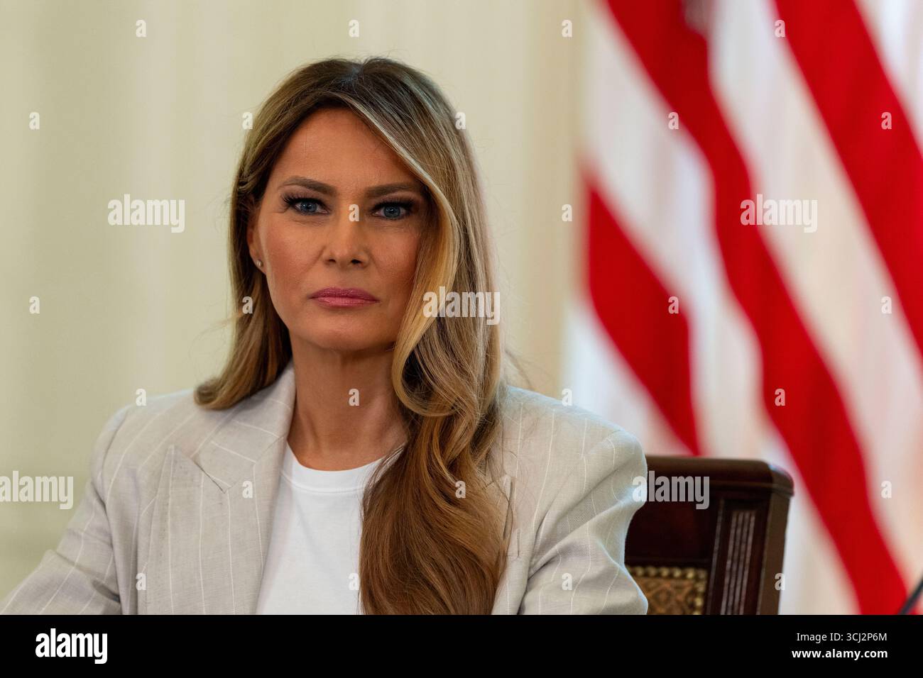 First lady Melania Trump listens during a meeting of the White House ...