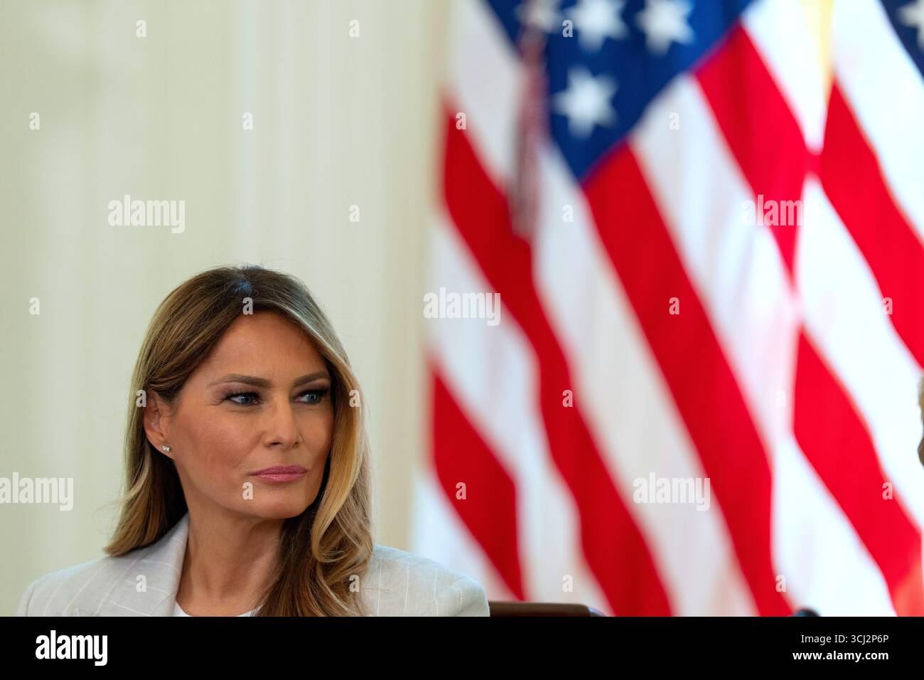 First lady Melania Trump listens during a meeting of the White House ...