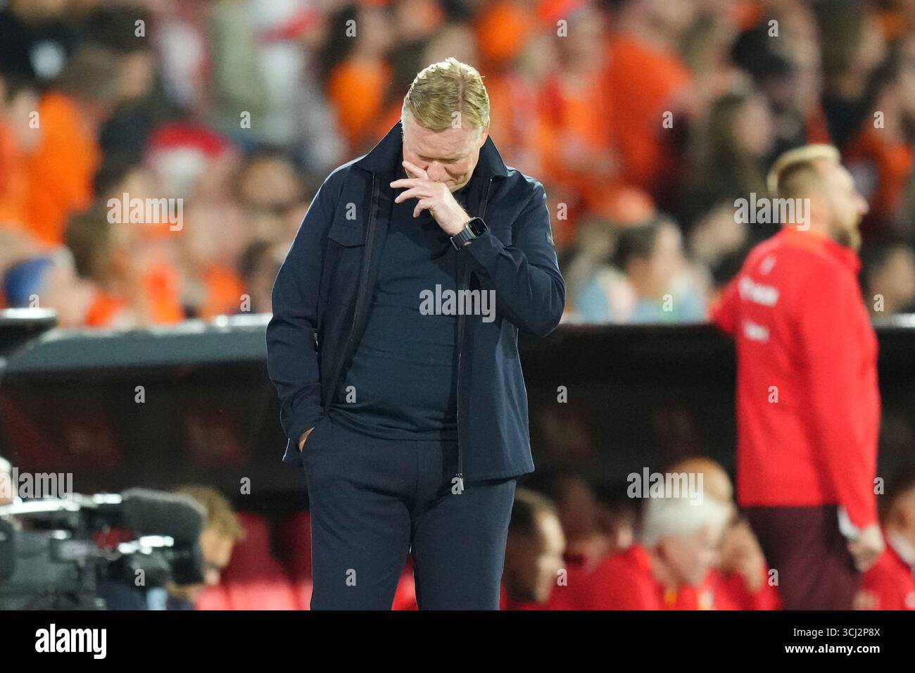 Netherlands head coach Ronald Koeman walks on the sideline during a ...